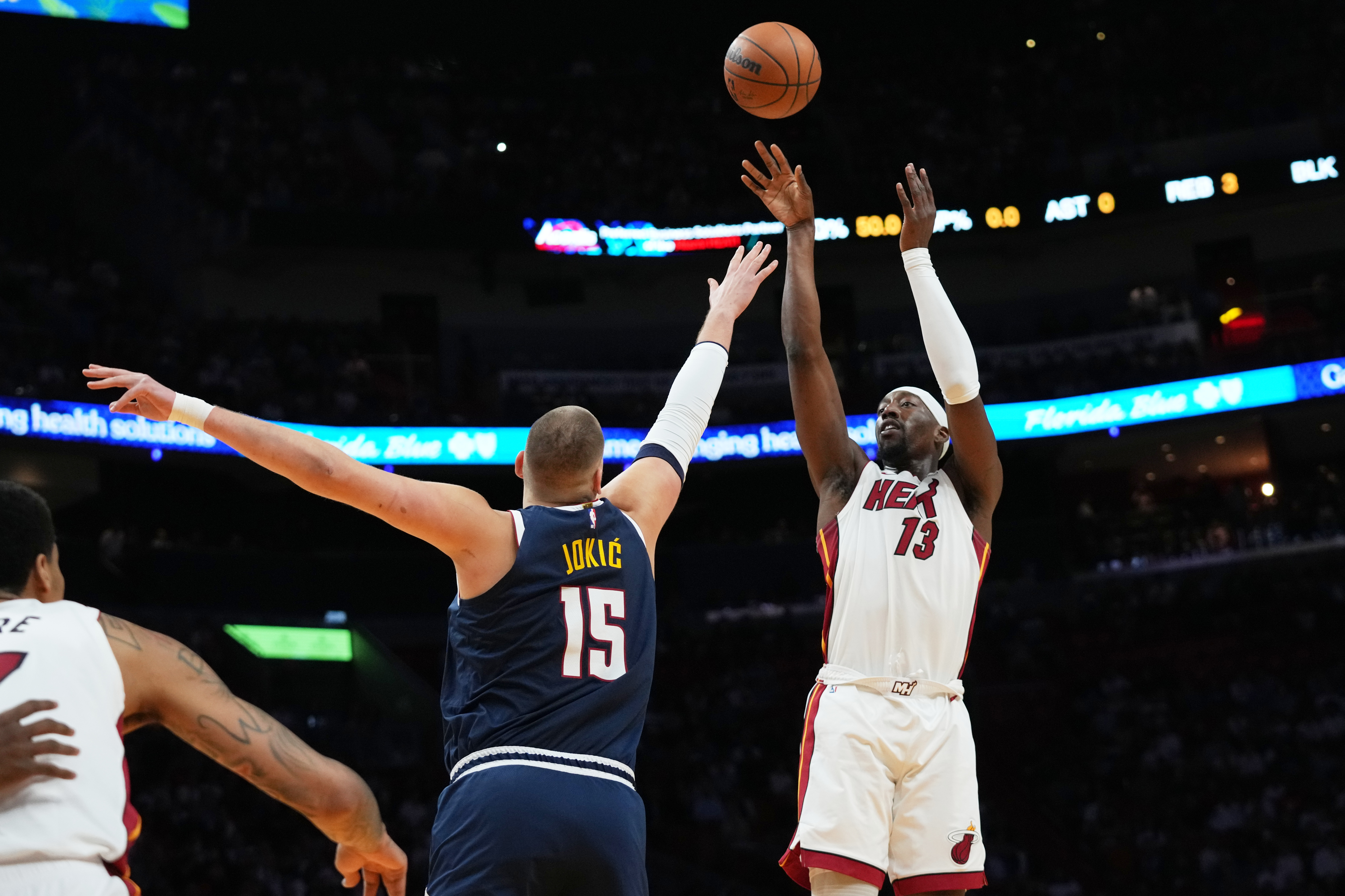 Jokic gets hurt late in 1st half, Heat pull away from there to top ...