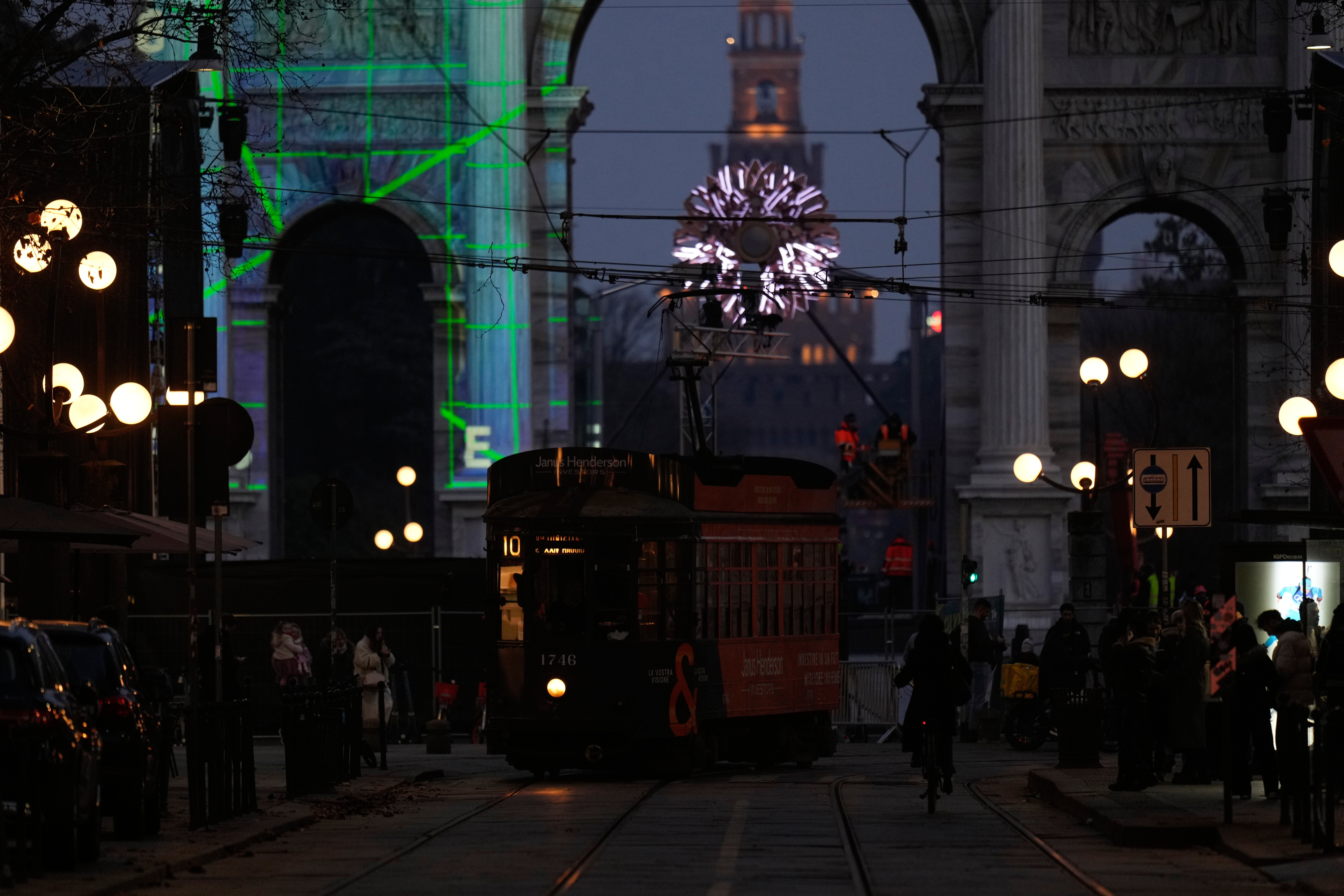 Milan’s historical trams at night as the city gears up for the Winter ...