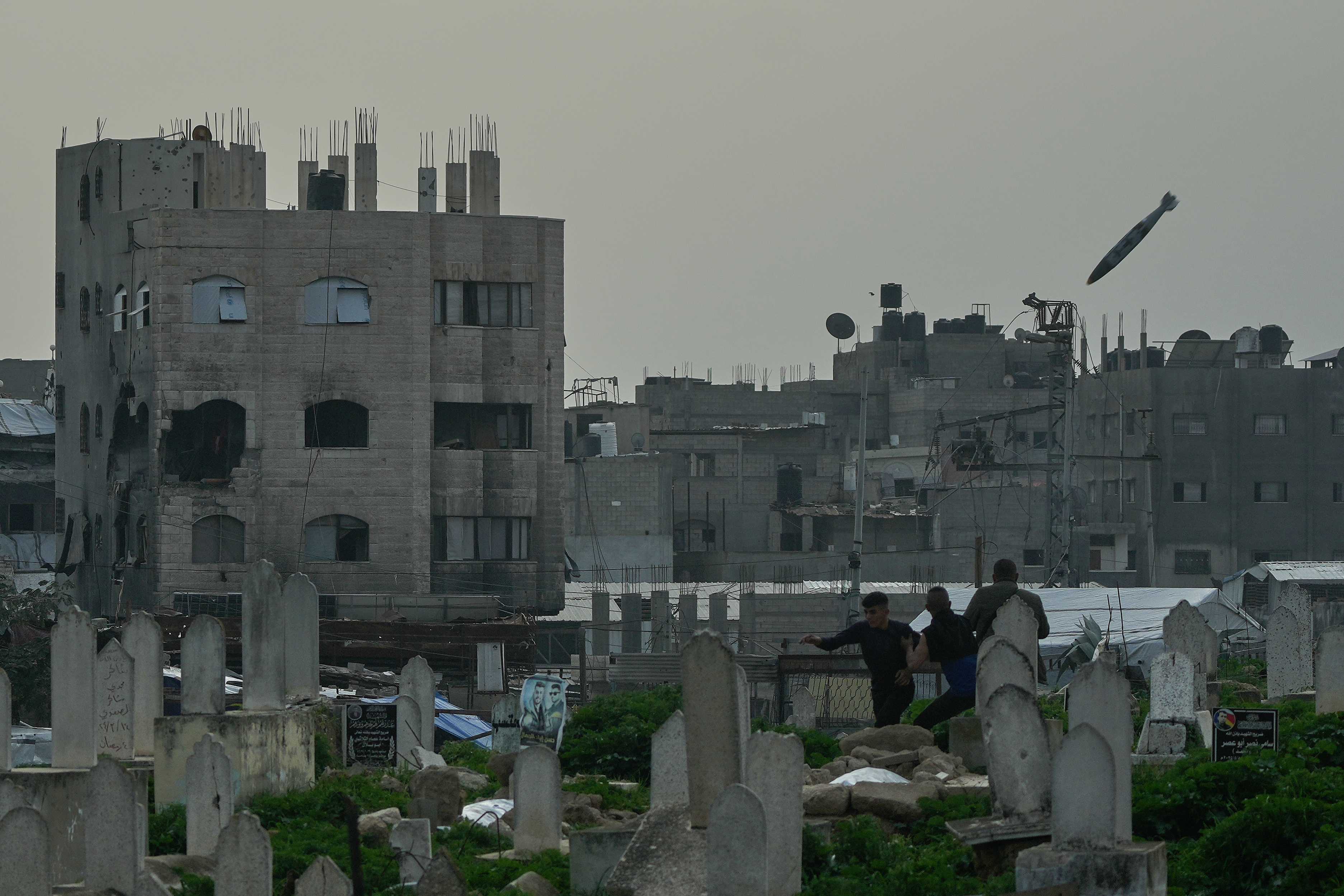 Photos show an Israeli strike blowing up a Gaza building in split ...