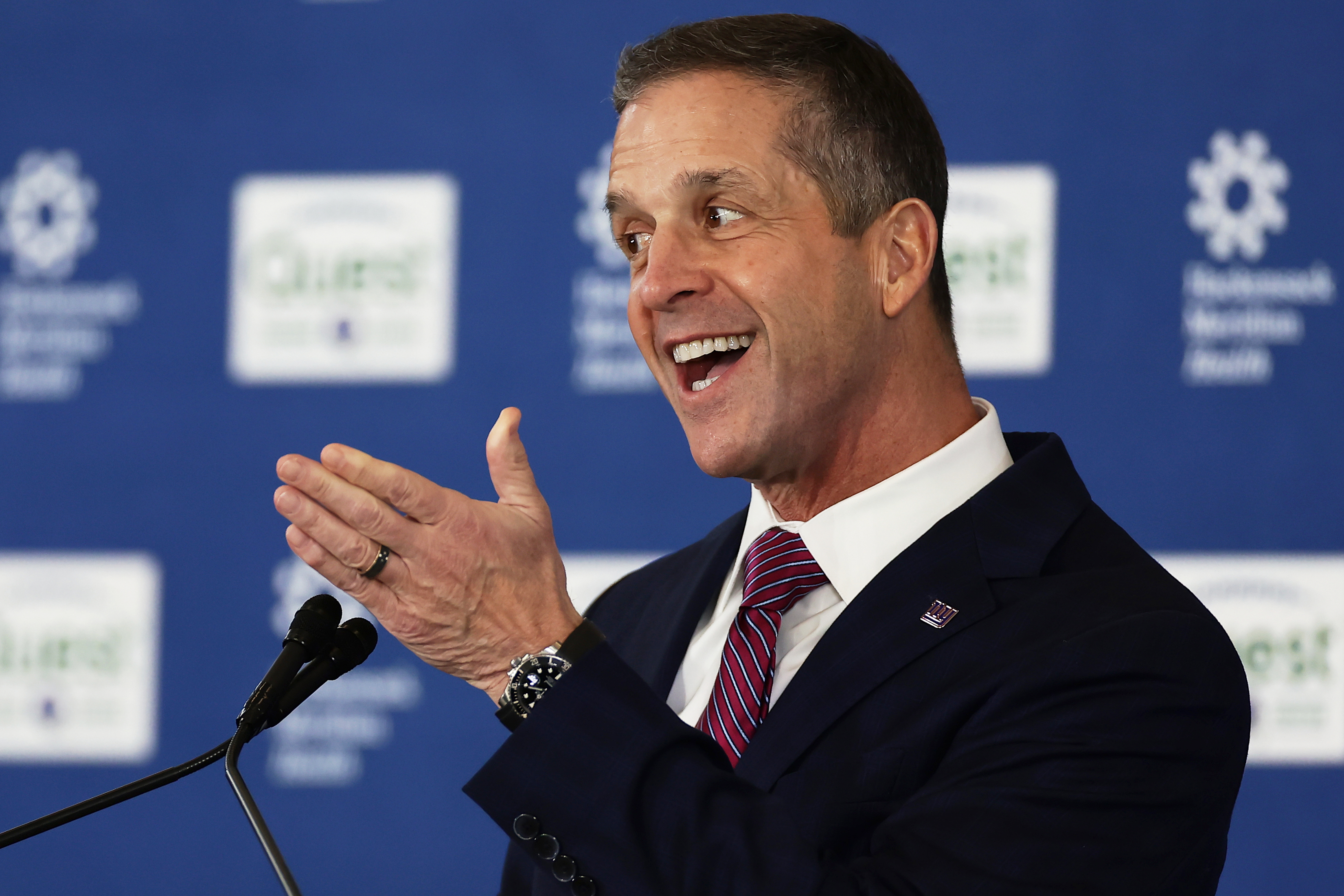 New coach John Harbaugh embraces the challenge of turning the Giants ...
