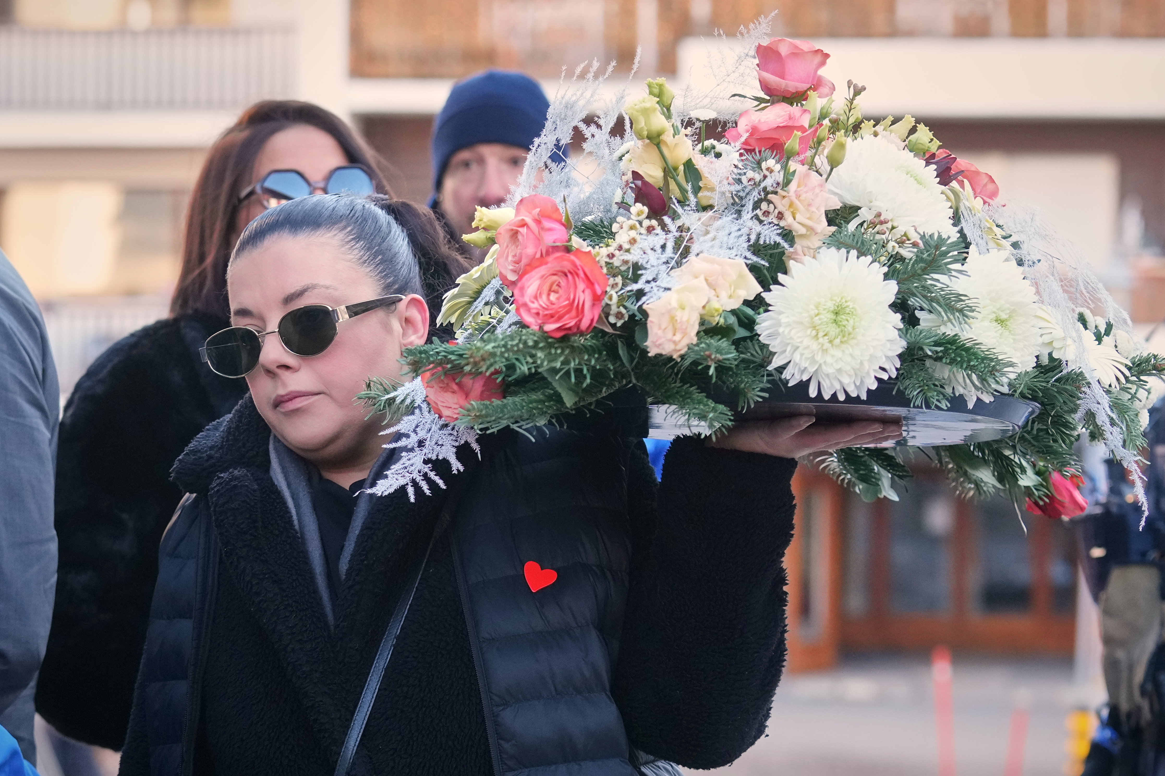 A mother says goodbye to her son as Swiss community grieves after ...
