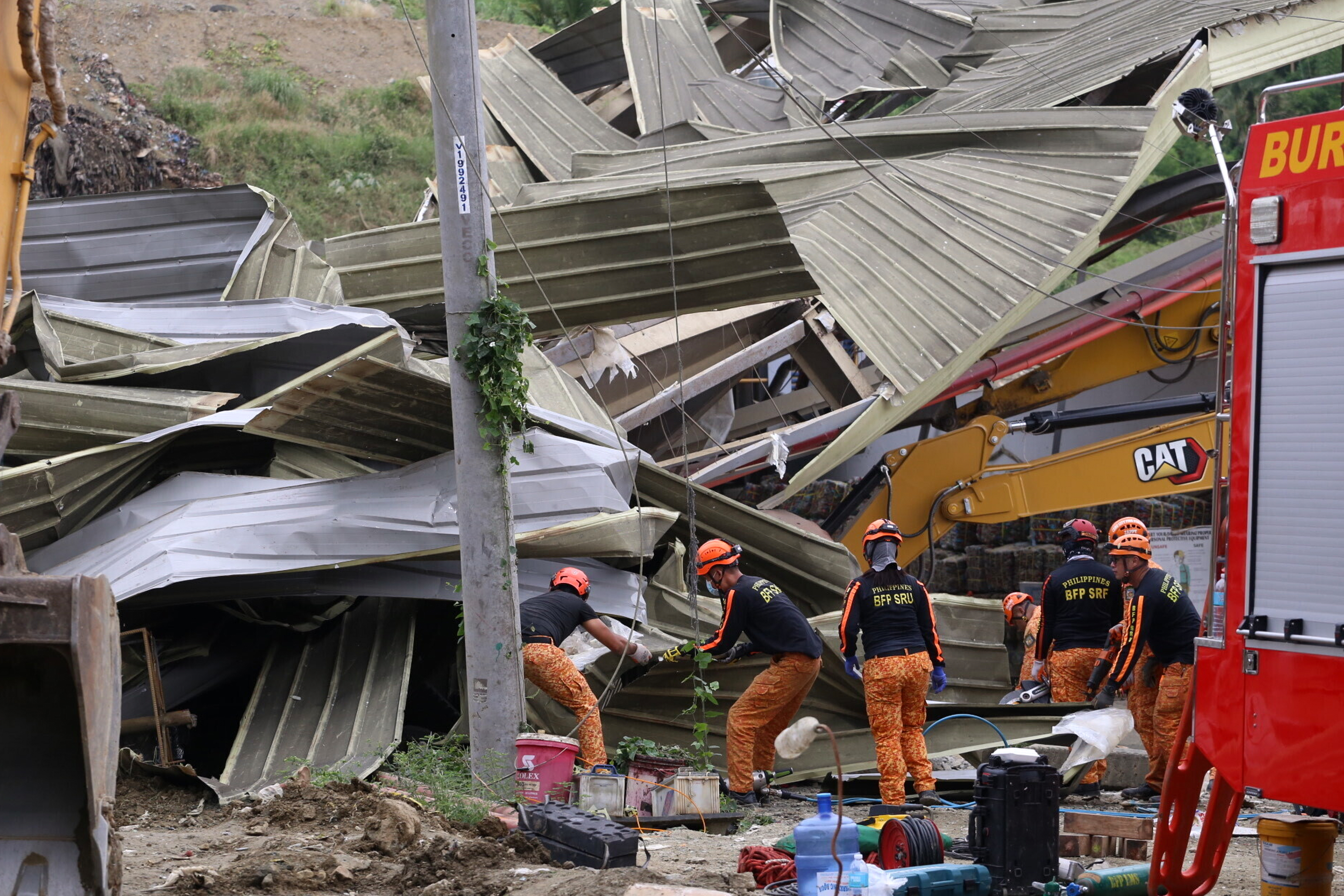 Photos show aftermath of avalanche of garbage at a Philippines landfill ...