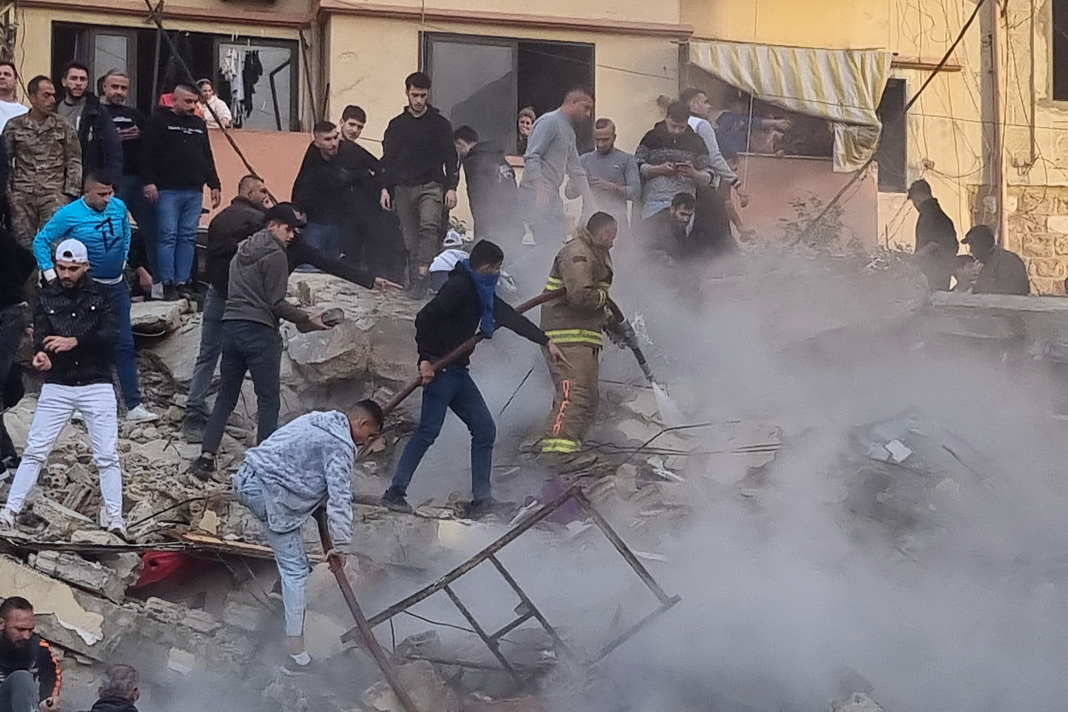 Rescue teams search for survivors after building collapse in northern ...